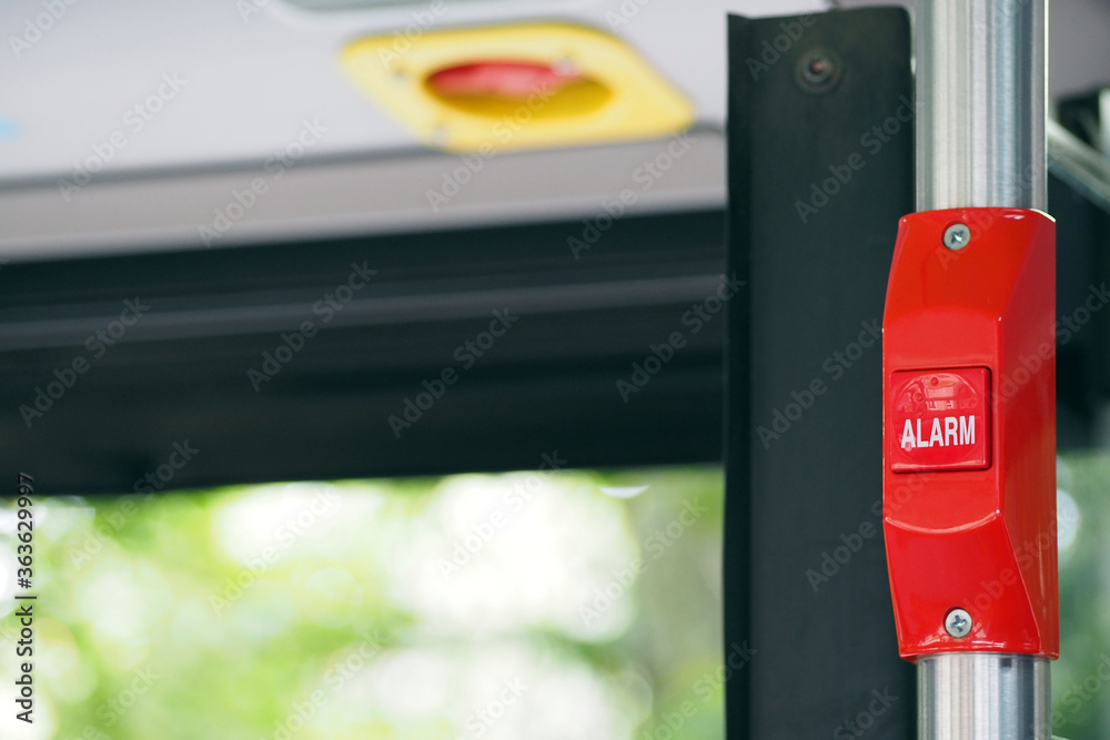 red button on the bus to signal the driver to make a stop . inside a ...