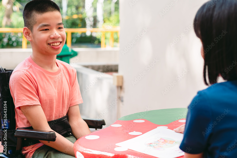 Disabled child on wheelchair happy time to home school and reading a ...