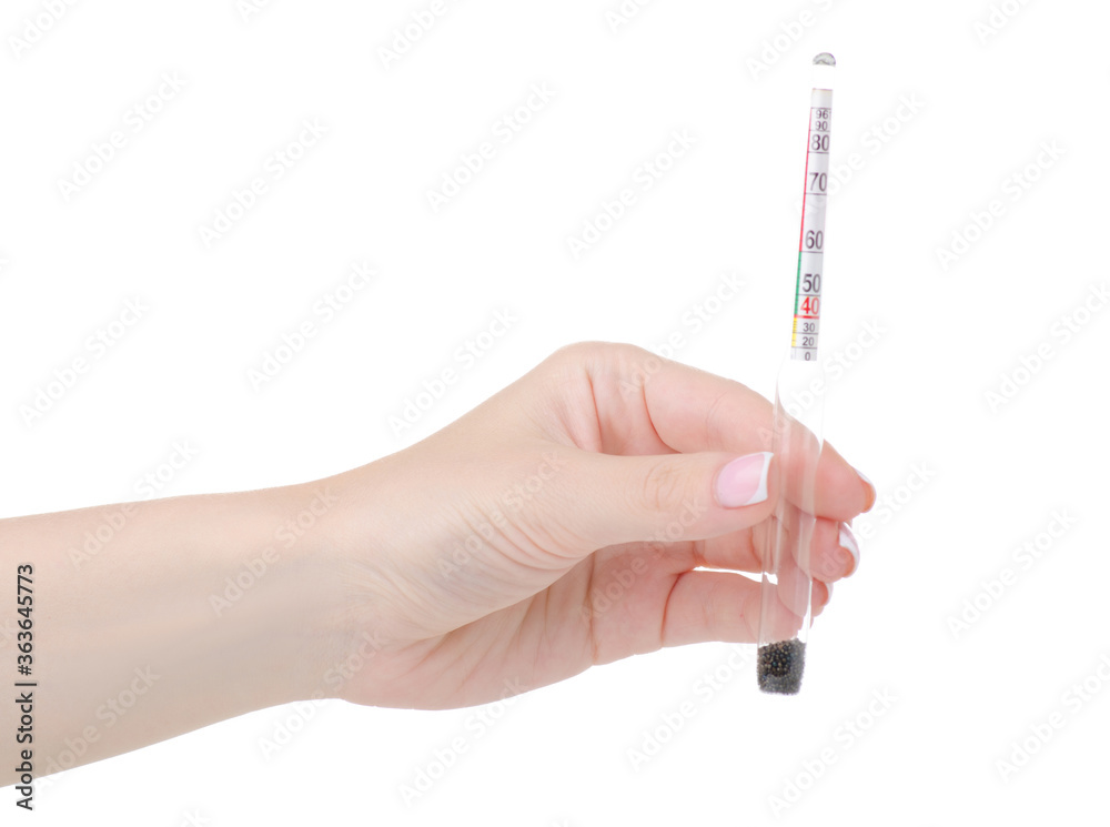 Hand holding glass alcohol meter for determining the amount of alcohol ...
