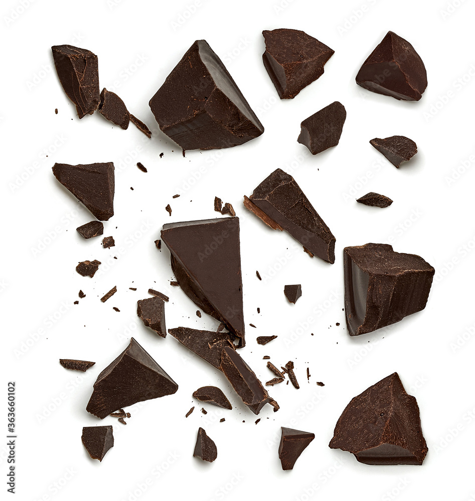 Cracked chocolates / broken chocolate chips or chocolate parts top view ...