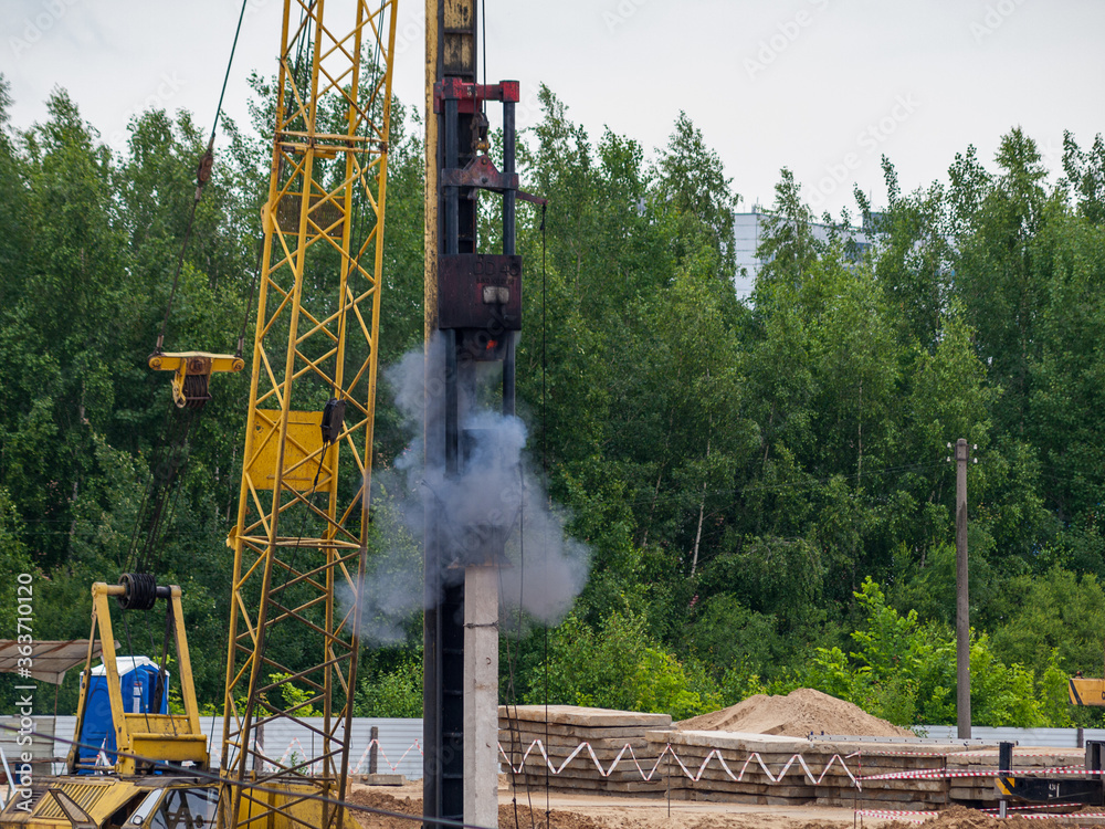 Drop hammer while working on driving piles, diesel hammer strikes a ...