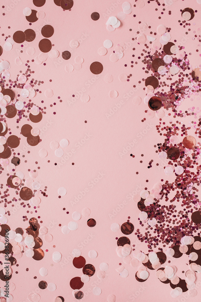 Pink celebration background with holiday sparkling confetti. Flat lay ...