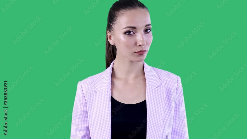 Strict aggressive girl in casual clothes showing stop gesture, keeping ...