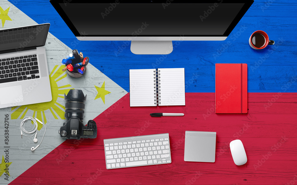 Philippines flag background with headphone,camera, notebook and mouse ...