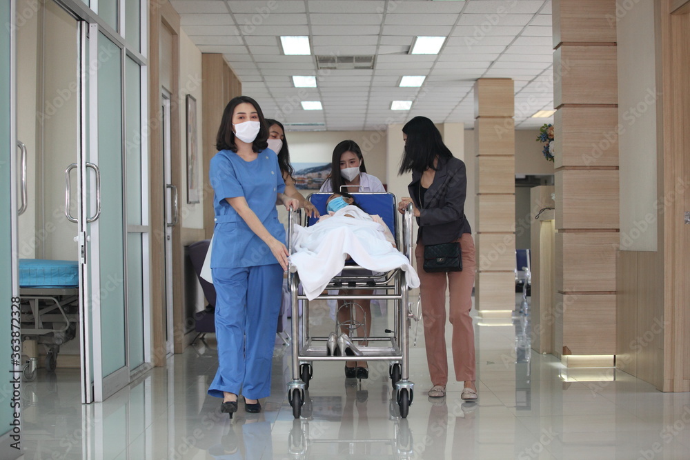 Rescue staff with emergency case sick person moving to ICU, and meet a doctor in hospital ...