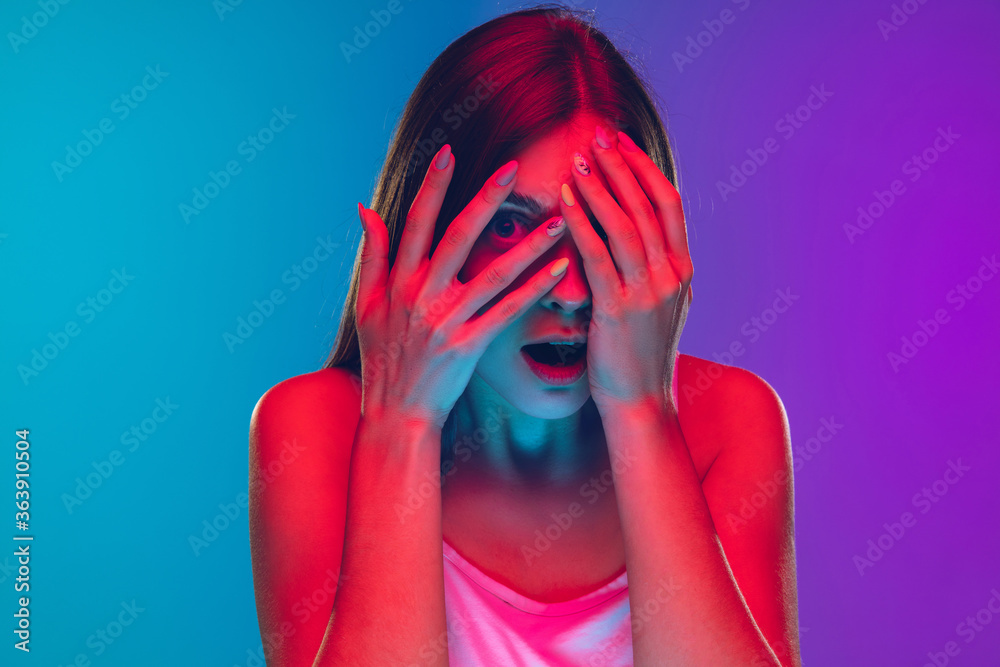 Shocked, scared, hiding face. Caucasian young woman's portrait on ...