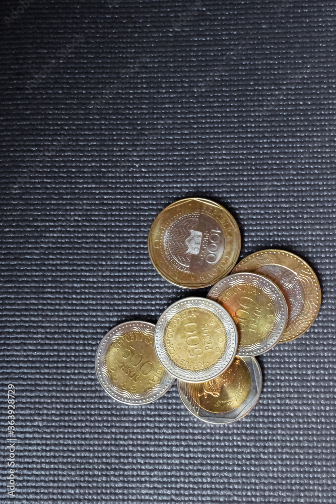 Six coins of different denominations stacked, bimetallic Colombian ...