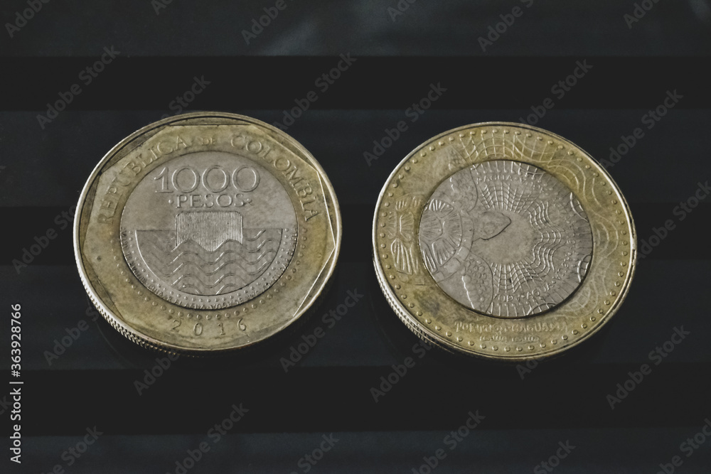 Coins of the same denomination, showing the obverse and reverse sides ...