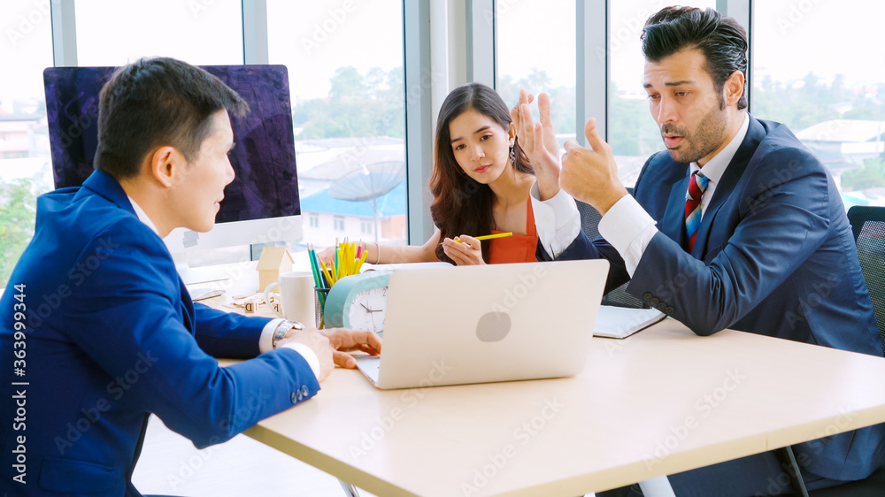 Smart businessman and businesswoman talking discussion in group meeting ...