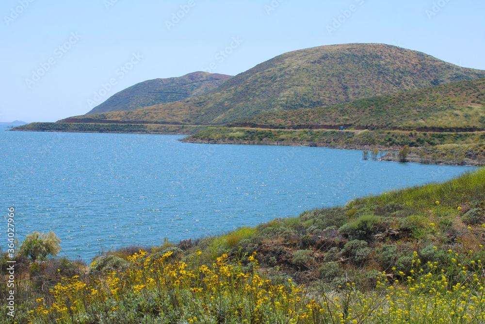 a gorgeous summer landscape at Diamond Valley Lake with rippling blue ...