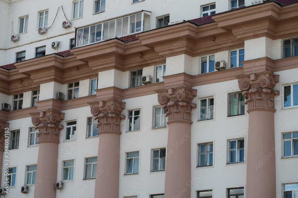 Column decoration of the facade of a multi-story building Stock Photo ...