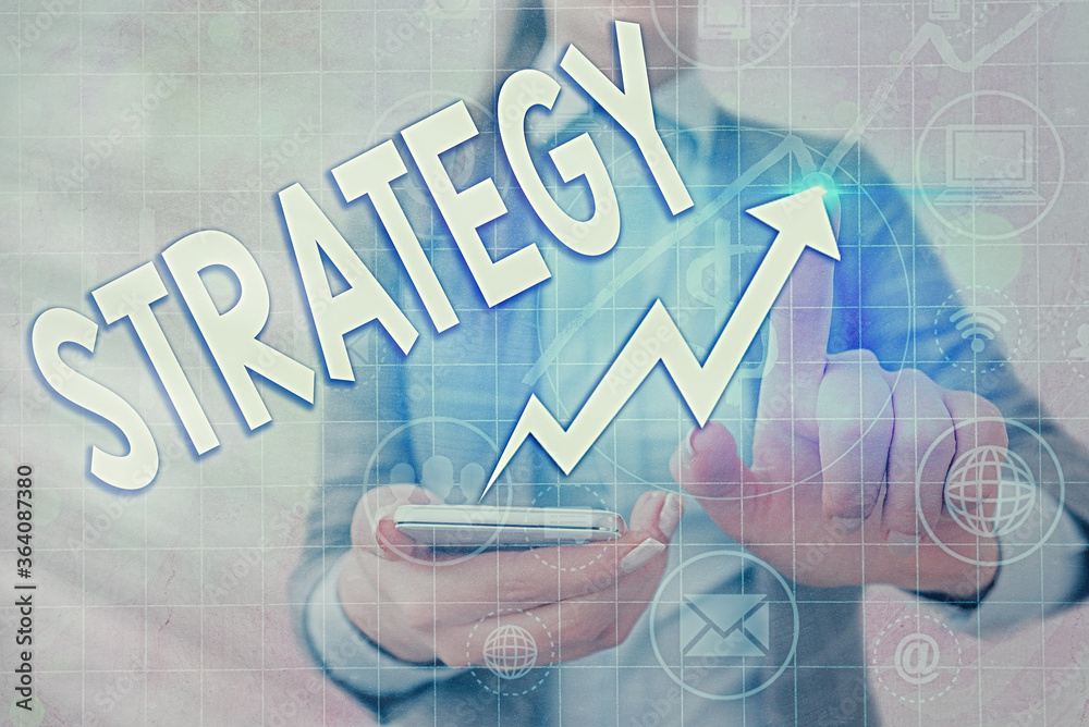 Writing note showing Strategy. Business concept for action plan or ...