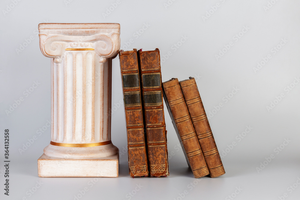 Ancient Greek column and old books. Isolated on white background. No ...