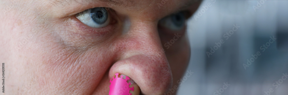 Foto de Man put his finger in nose coronavirus germs. Attack by mucous ...