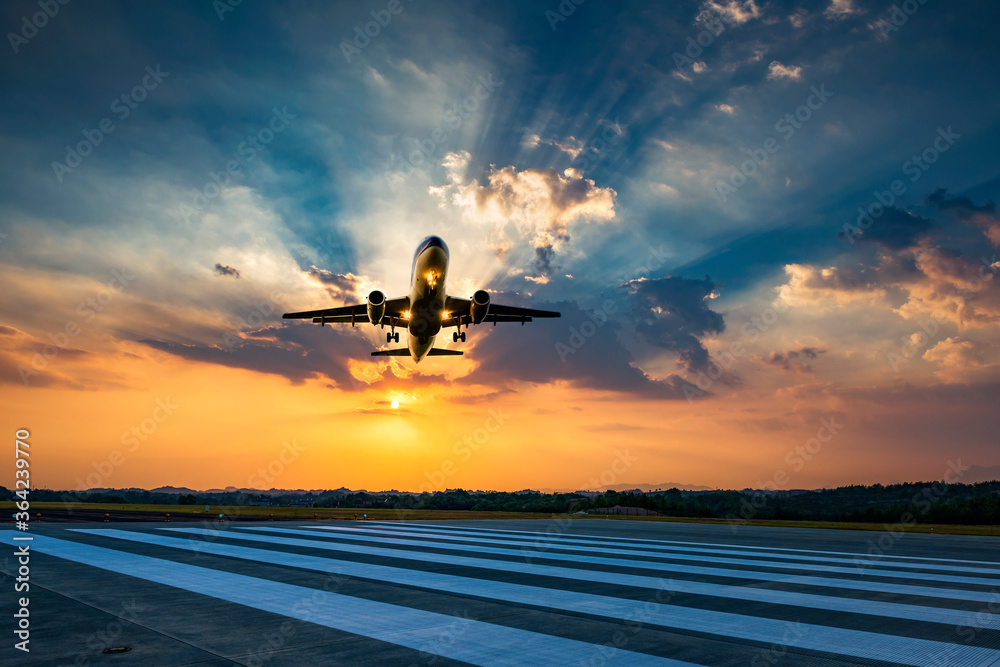 passenger plane fly up over take-off runway from airport Stock Photo ...