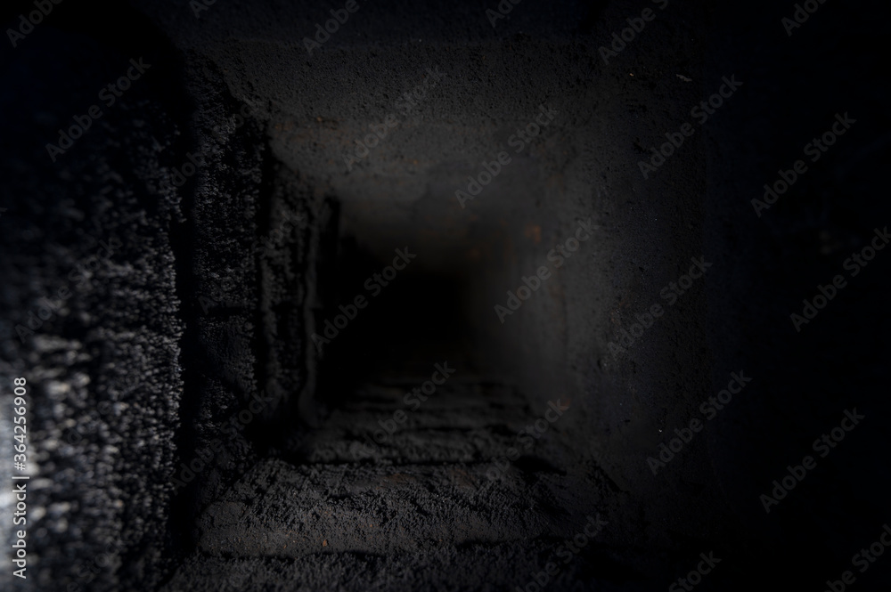 the background texture of a shaft well pipe furnace which is covered ...