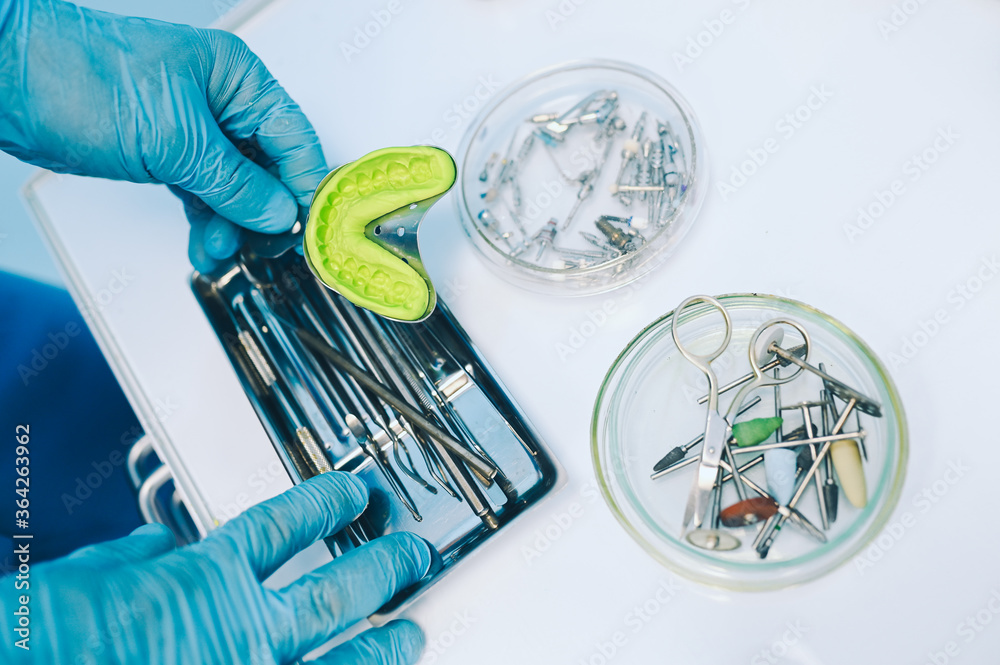 Different professional dental equipment, instruments and tools in a ...