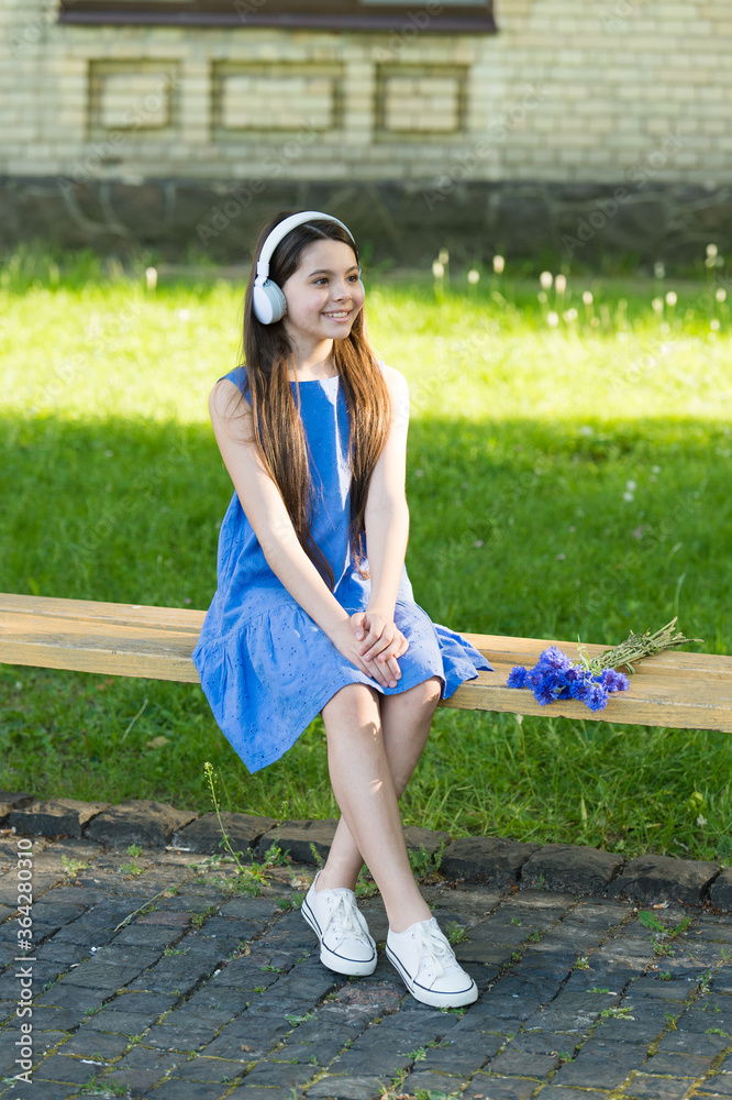 Foto de Just chill. Happy girl listen to music on park bench. Chill ...