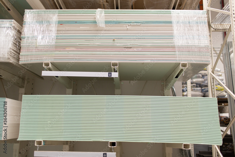 Pallet with Drywall sheets plasterboard in the building warehouse store ...