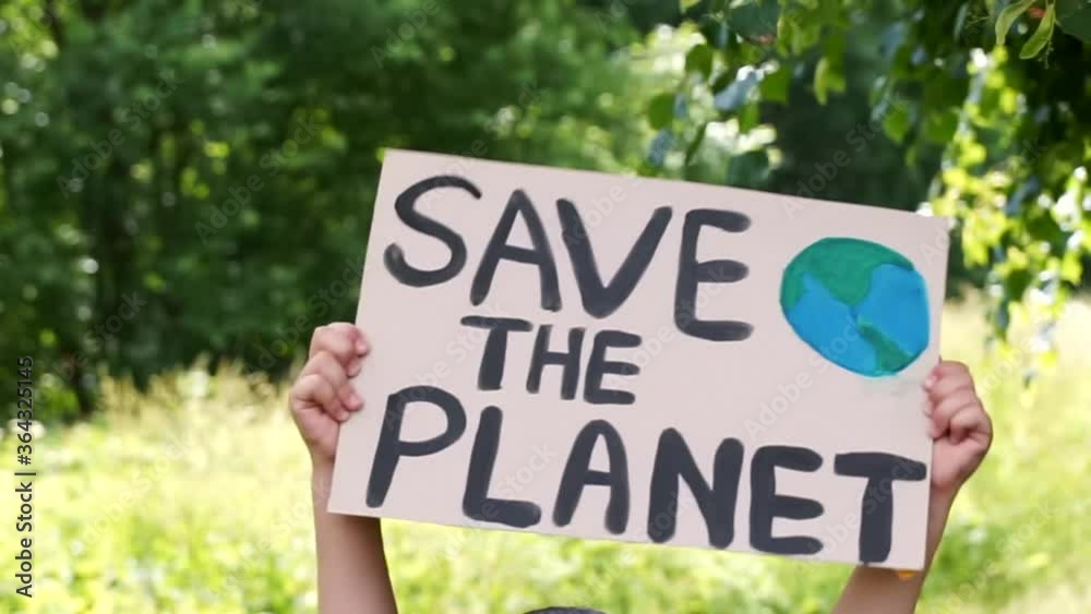 demonstration against global warming and pollution. Child boy making ...