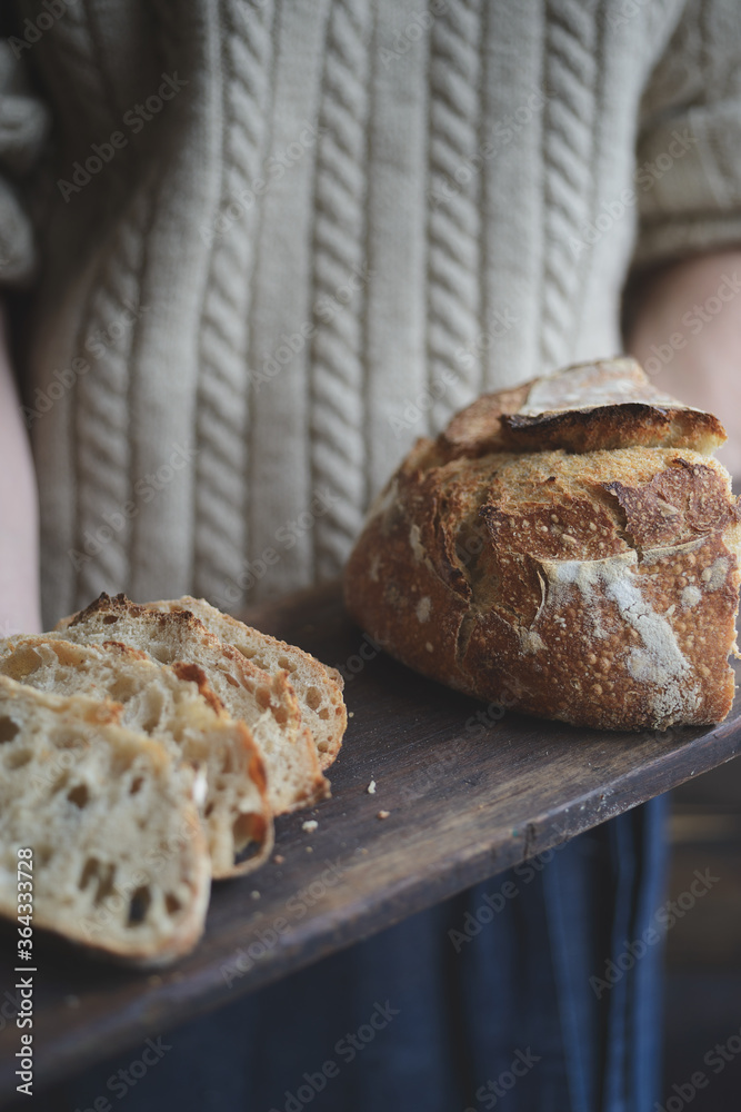Baked bread of sourdough in hands. Artisan bread. The bread of ...