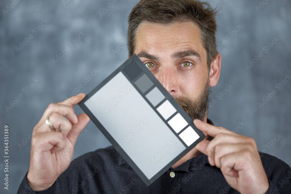 The model holds a color card in its hands for correct color transfer ...