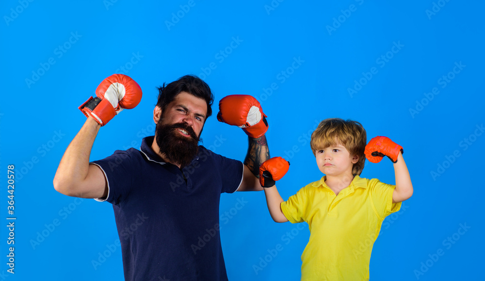 Parenthood relationship. Little boy sportsman at boxing training with ...