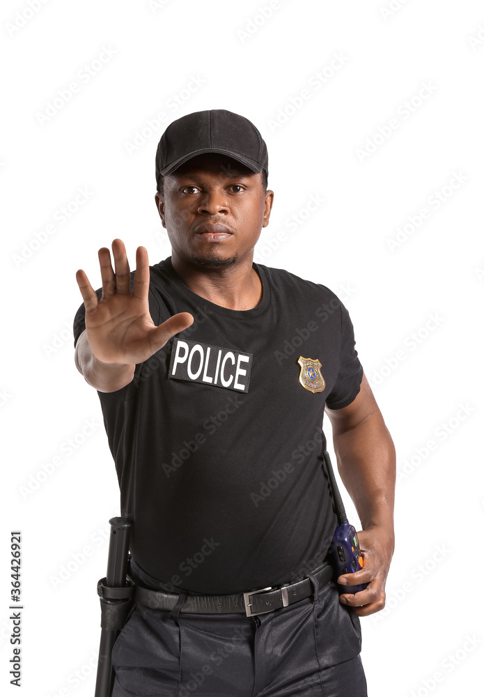 Aggressive African-American police officer on white background Stock ...