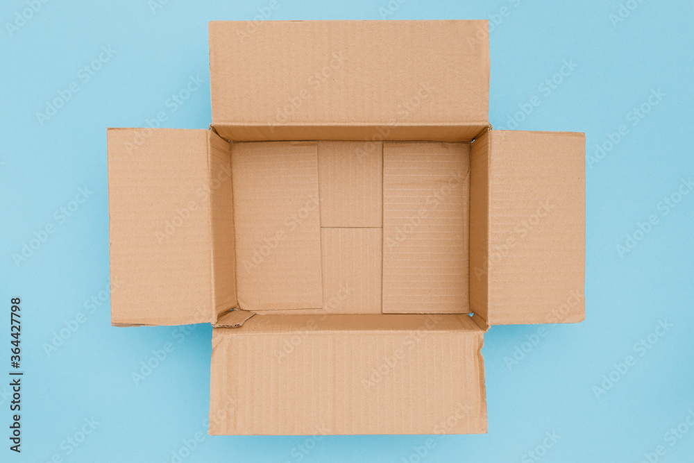 blank open cardboard box in top view isolated on blue background Stock ...