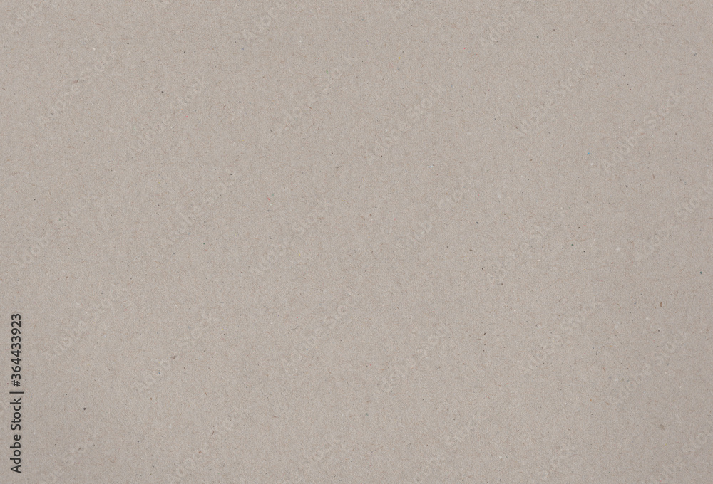 Sheet of brownish grey paper carton background with inclusions of ...