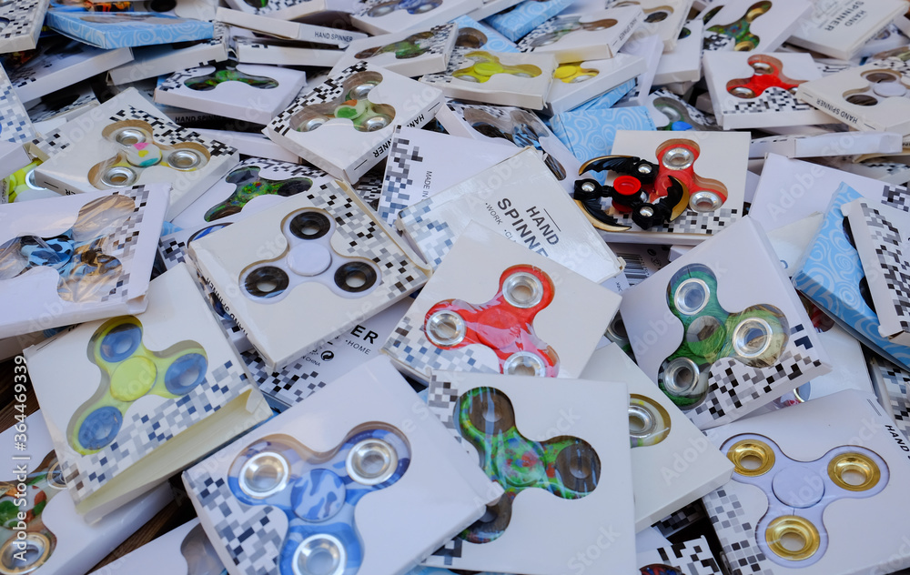 Fiidget spinners for sale at local street market Stock Photo | Adobe Stock
