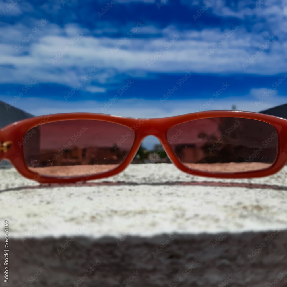 Foto de Chennai, India - July 3 2020: Red color glass placed in wall to ...