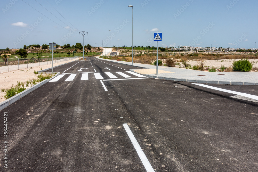 new road markings and road signs on freshly tarmacked roads on spanish ...