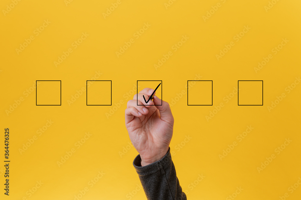 Drawing a check mark in the middle box in a row of five Stock Photo ...
