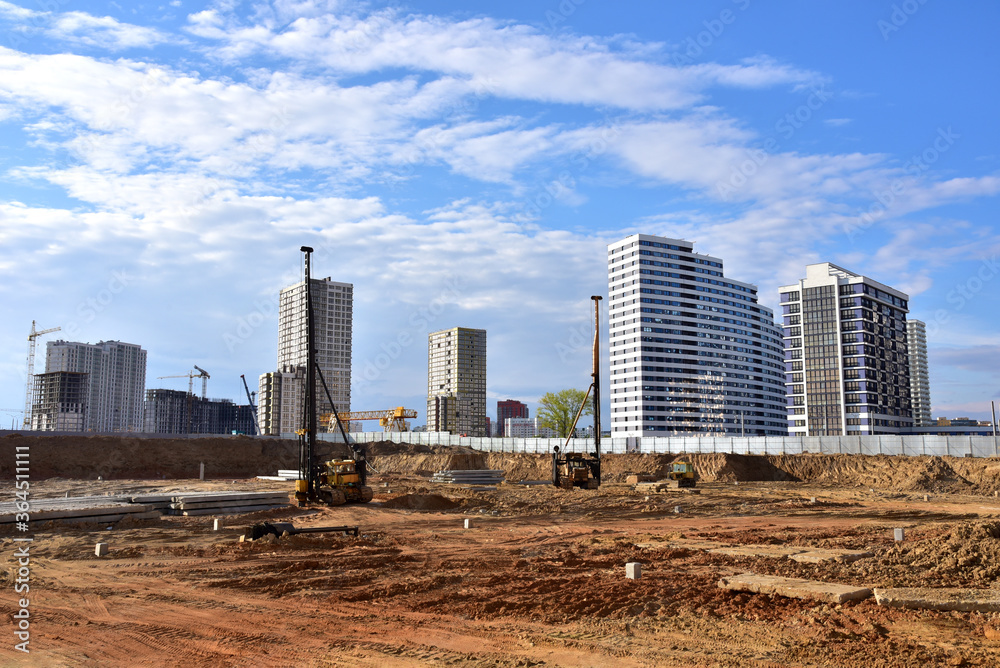 Construction site with machinery for deep foundation piling. Vibrating ...