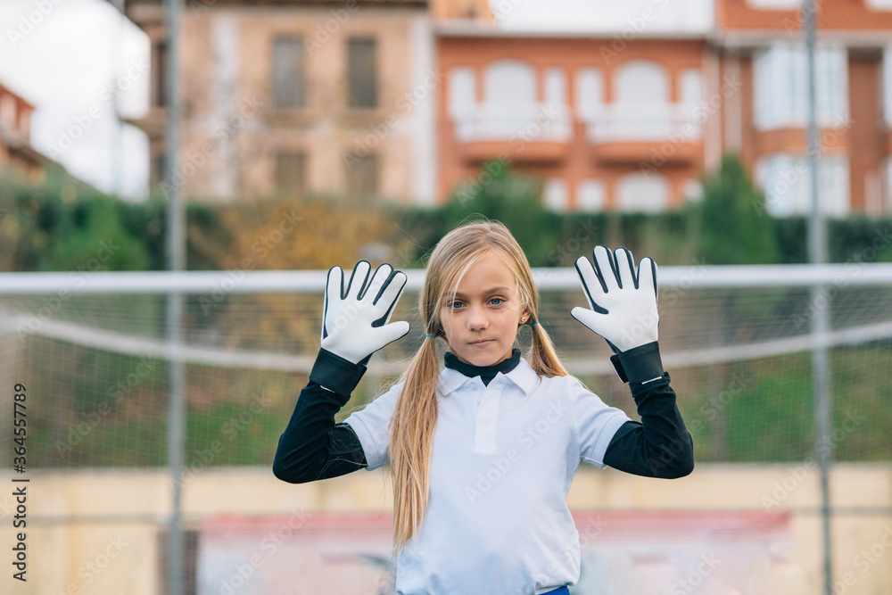 Full length serious preteen girl keeper in white and blue uniform ... Full length serious preteen girl keeper in white and blue uniform ...