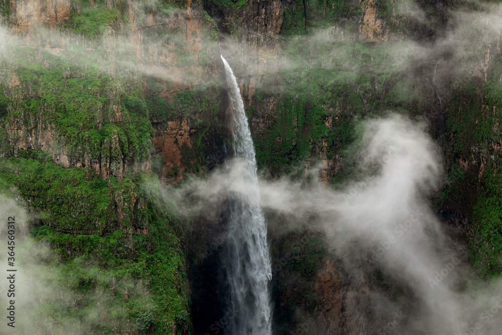 Drone view of amazing landscape of waterfall with rapid water falling ...