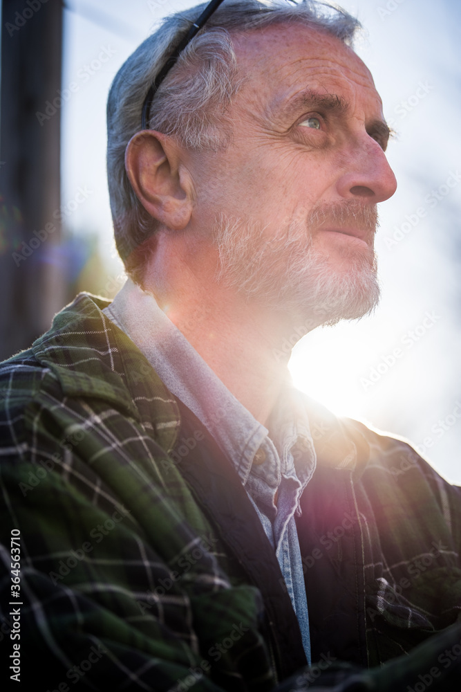 Older man with concerned look gray hair beard mustache glasses on top ...