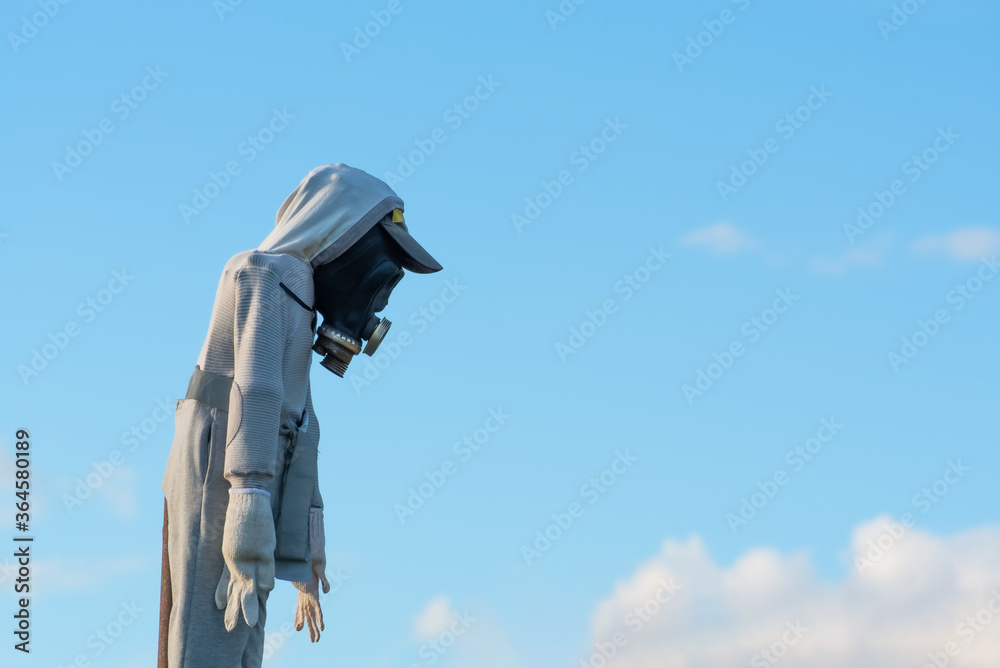 mannequin, scarecrow with gas mask against blue sky, symbolizing air ...