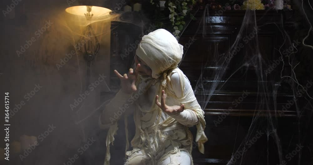 Vidéo Stock Cinematic footage of girl dressed in Halloween mummy ...