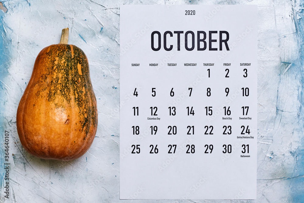 Simple 2020 October monthly calendar on the wooden desk with a pumpkin ...