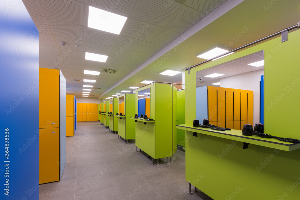 Interior of a indoor swimming pool changing and locker room with hair ...