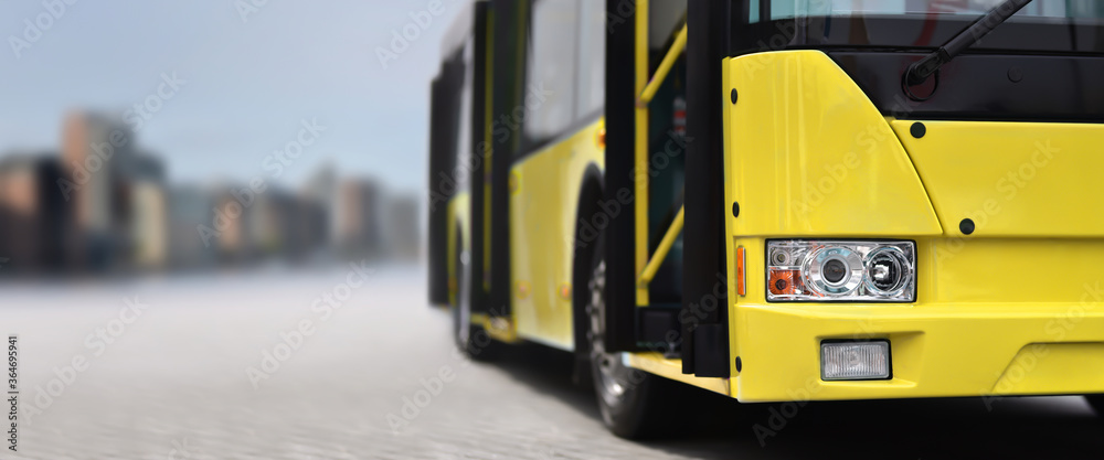 Yellow city bus on downtown background Stock Photo | Adobe Stock