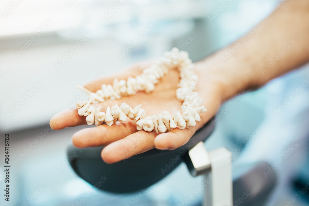 Healthy human teeth in the palm of your hand - caries treatment ...