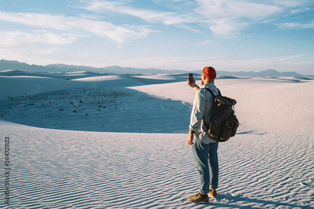 Hipster guy wanderlust making selfie on smartphone camera on ...