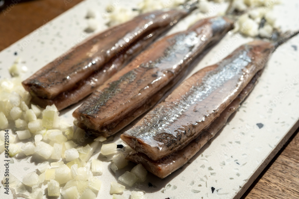 Season of new Dutch herring fresh salted fish ready to eat, traditional ...