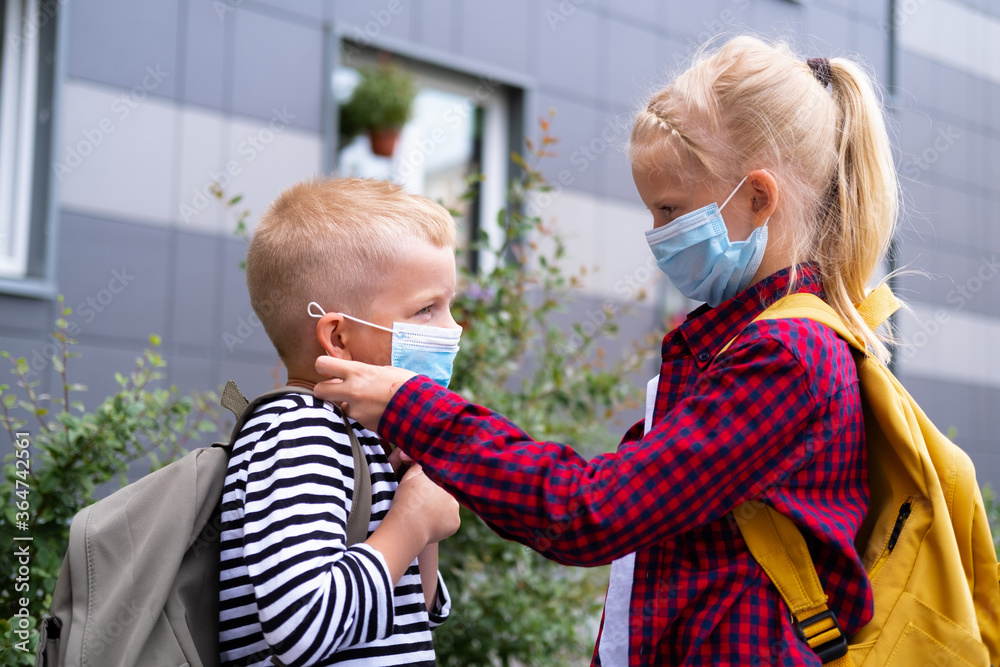 Kids wearing mask and backpacks protect and safety from coronavirus for ...