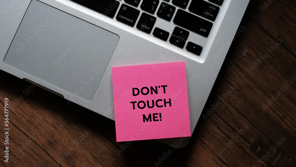 Don't Touch ME! message concept written post it on laptop keyboard ...