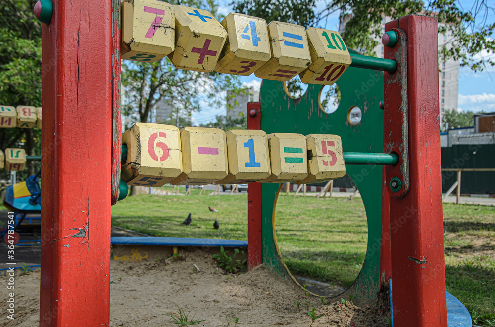 Large wooden cubes with colorful numbers on a street playground ...