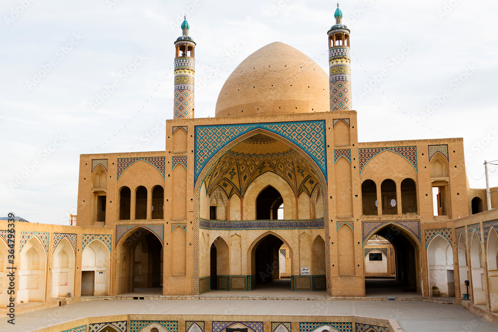 View of Agha Bozorg Mosque on blue sky background in Kashan, Iran ...